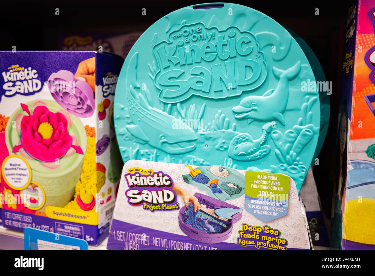 Lviv, Ukraine - March 19, 2025: Colorful kinetic sand packaging ...