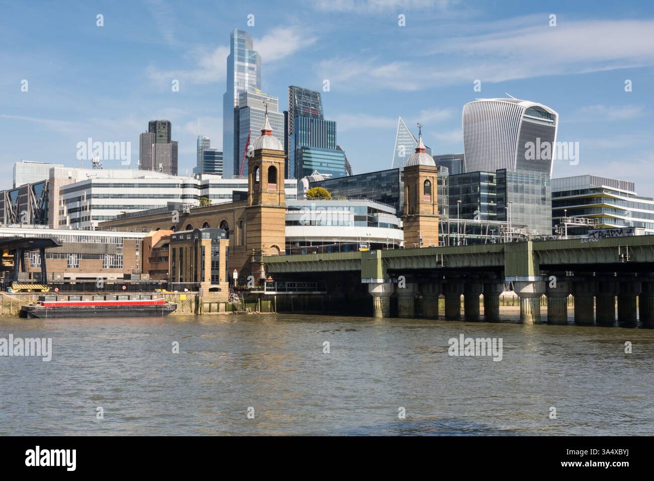 Cannon Street station and railway bridge and City of London skyscrapers ...