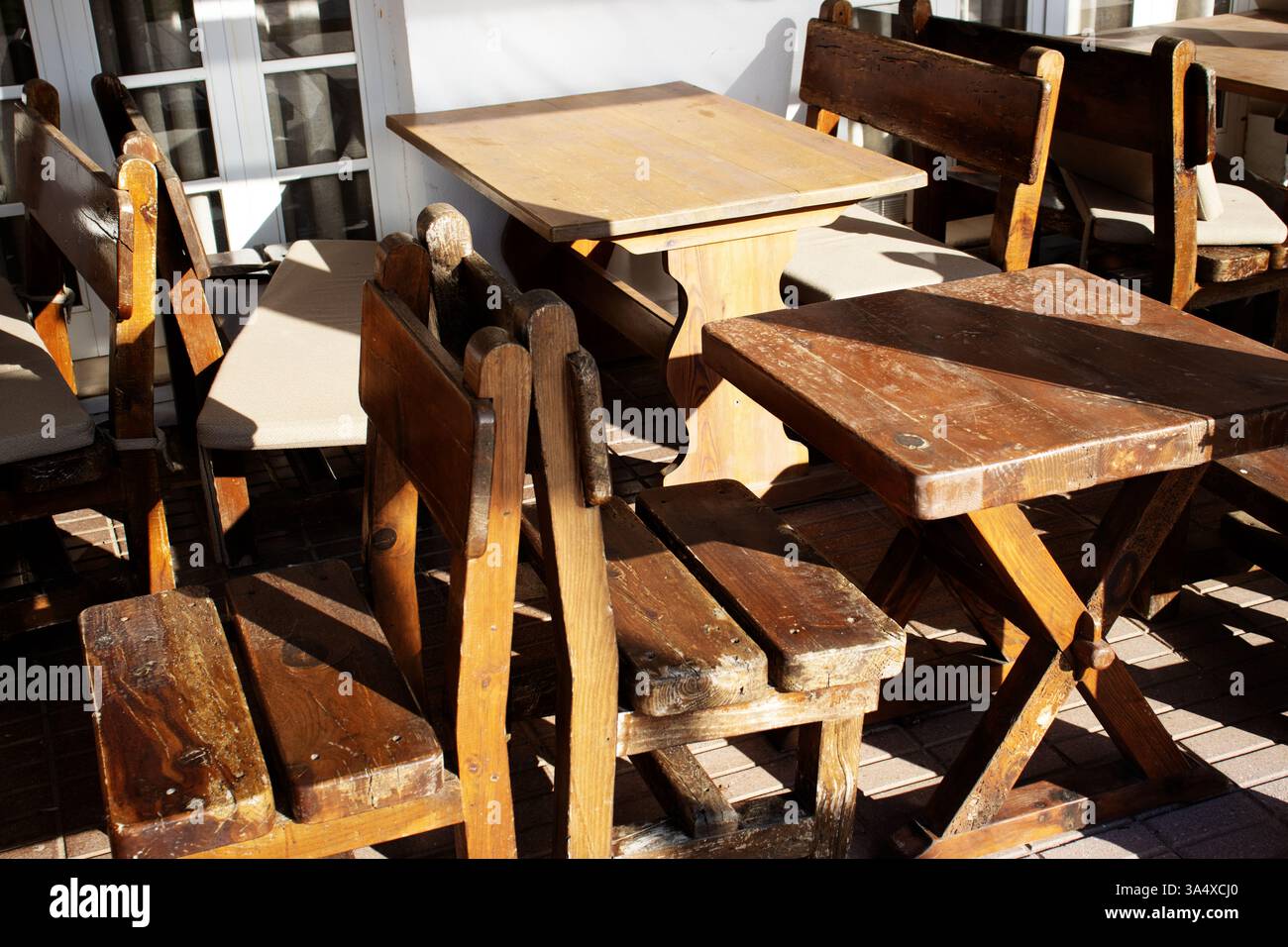 pile of wooden chairs and tables Stock Photo - Alamy