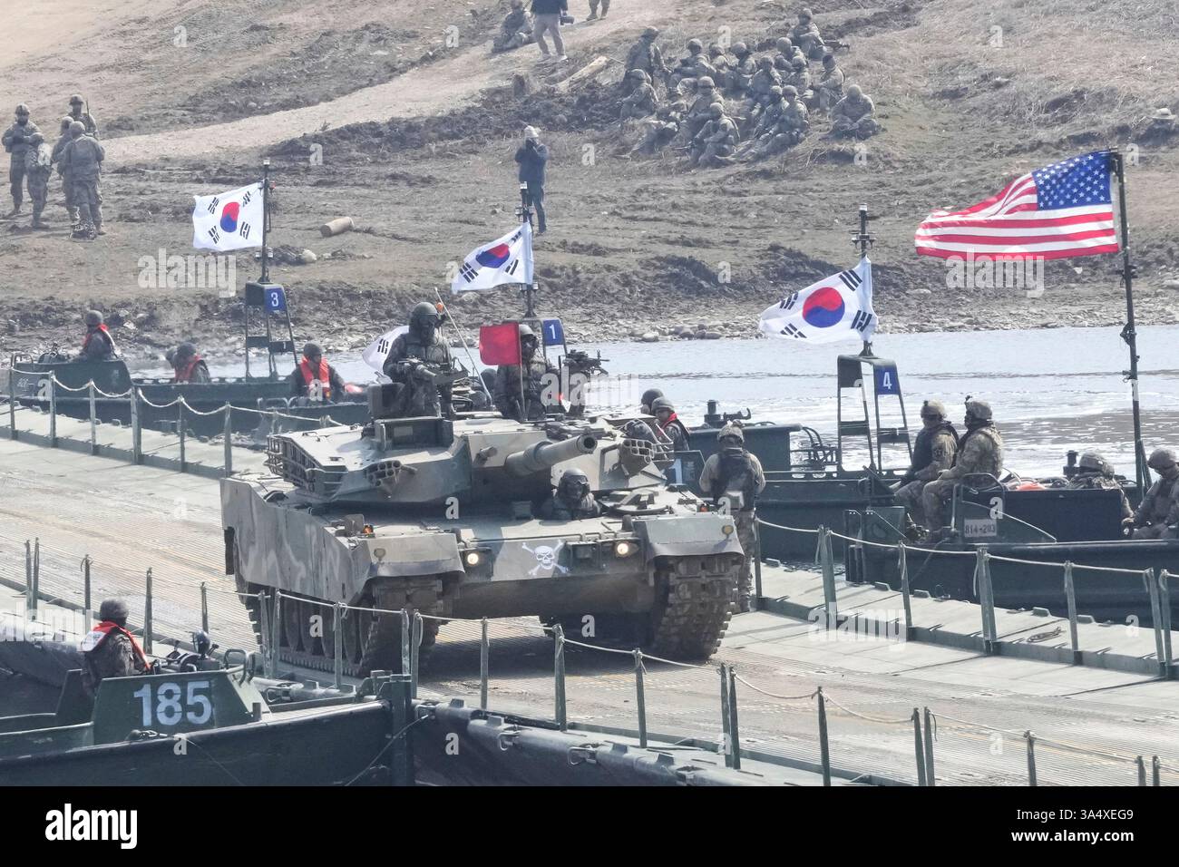 A South Korean army K1E1 tank crosses a floating bridge on the Imjin ...