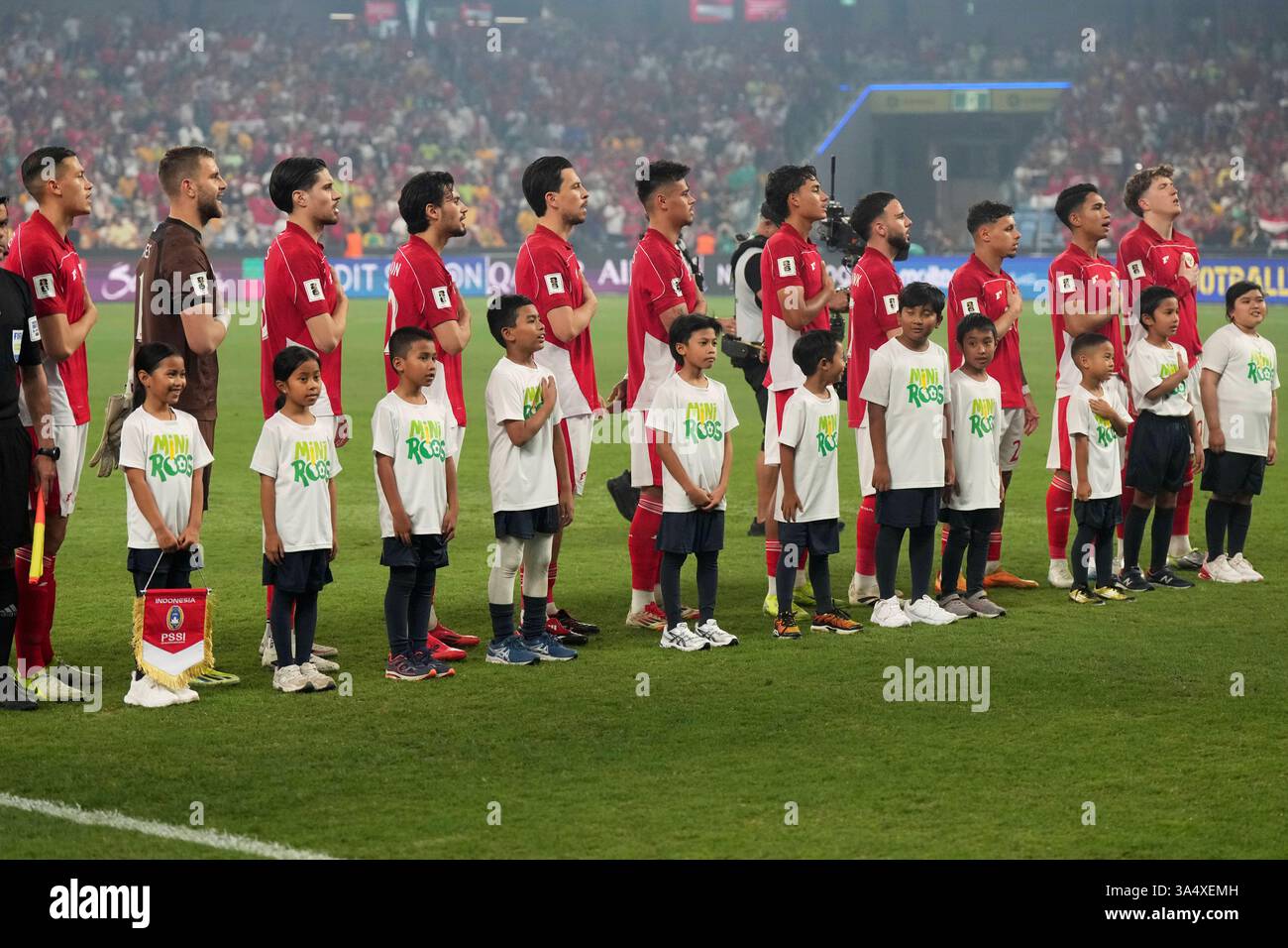 Indonesian players stand for their national anthem before their their ...