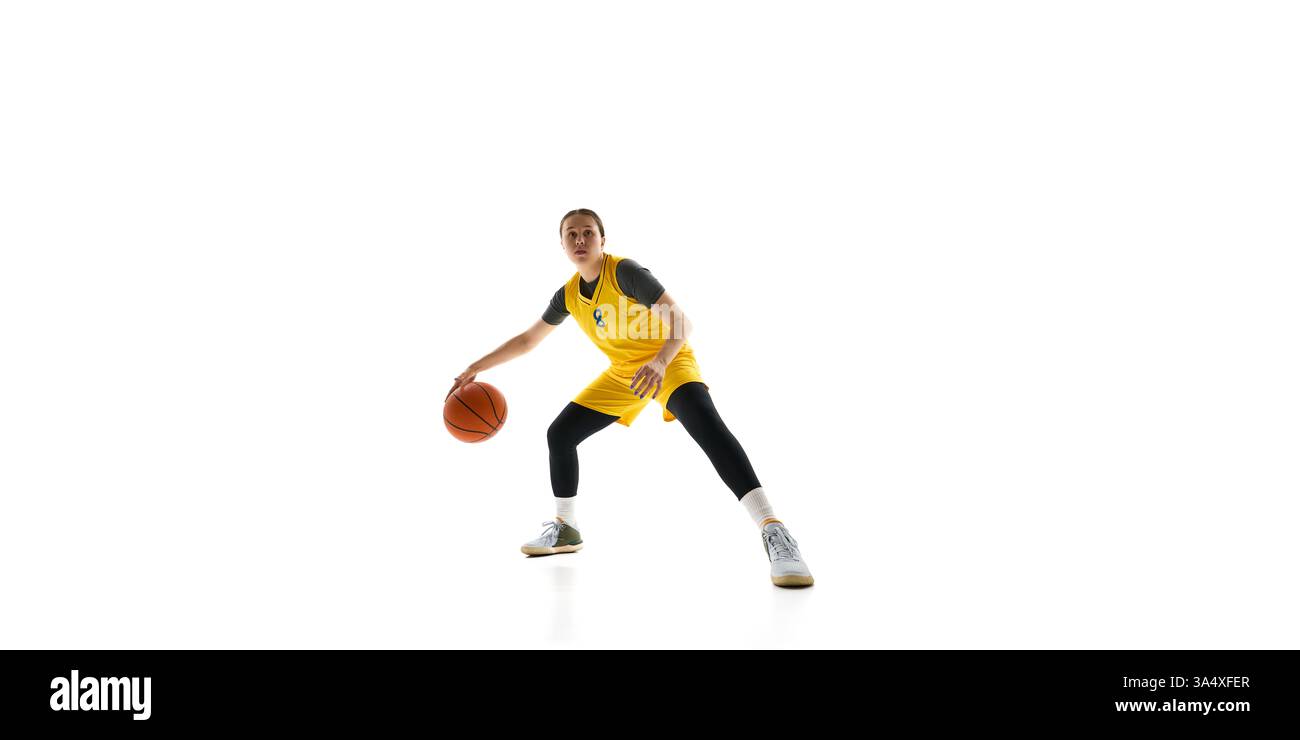 Women, basketball player in yellow jersey and black shorts in motion ...