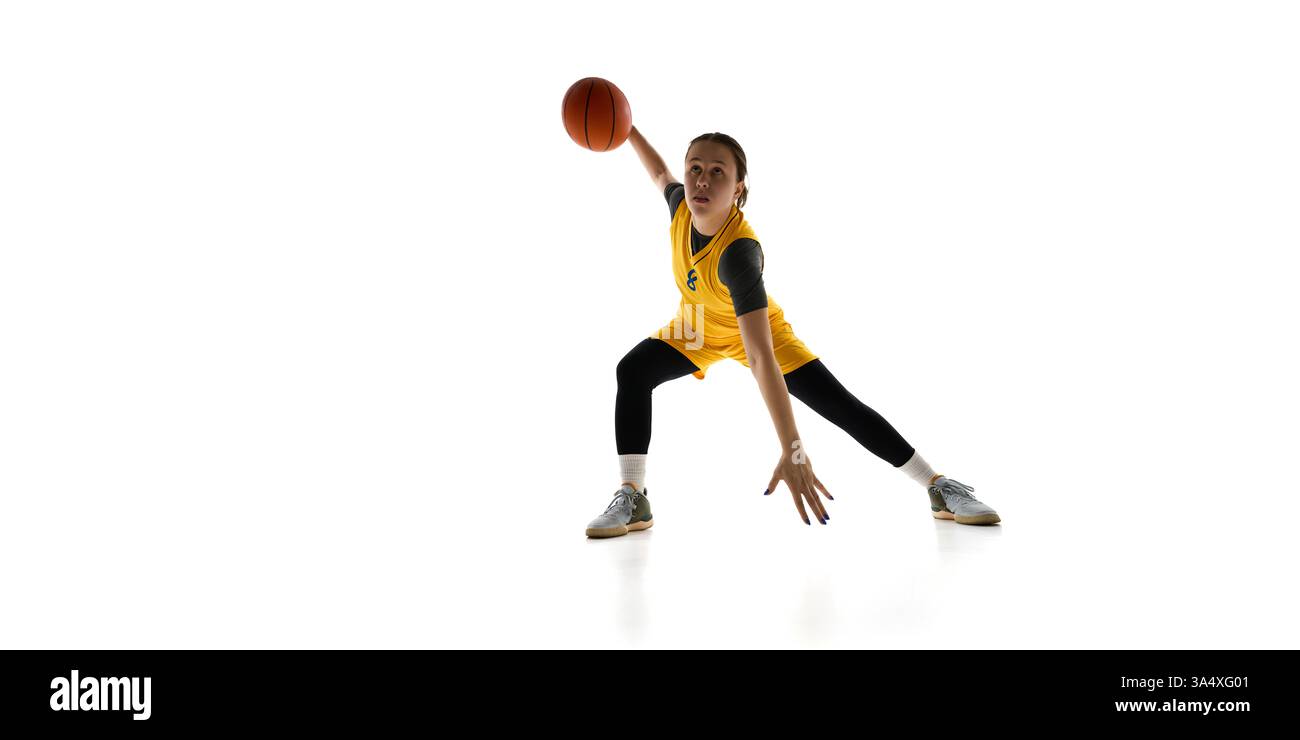 Dynamic image of focused female athlete, basketball player in motion ...