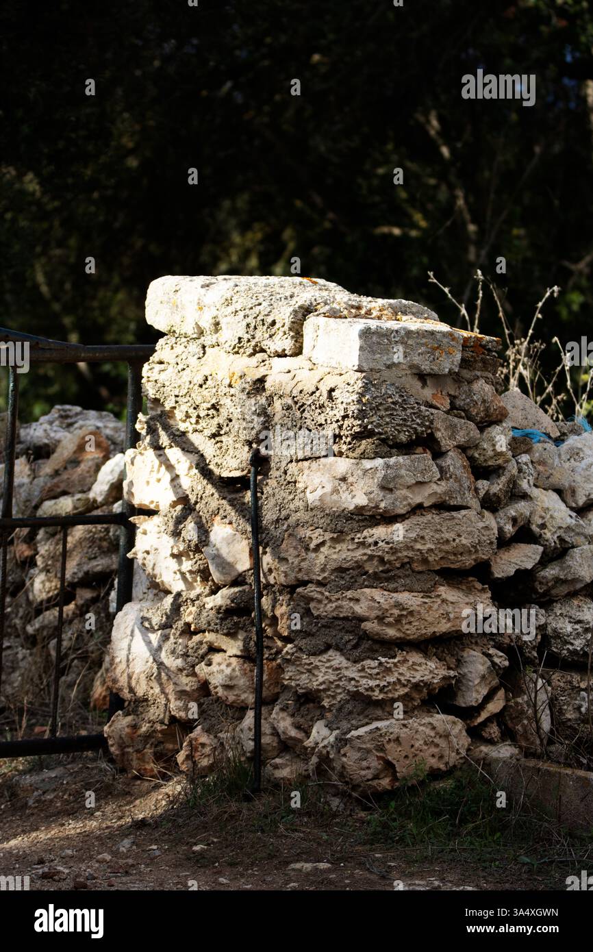 typical stone gate post with irongate and trees in the background Stock ...