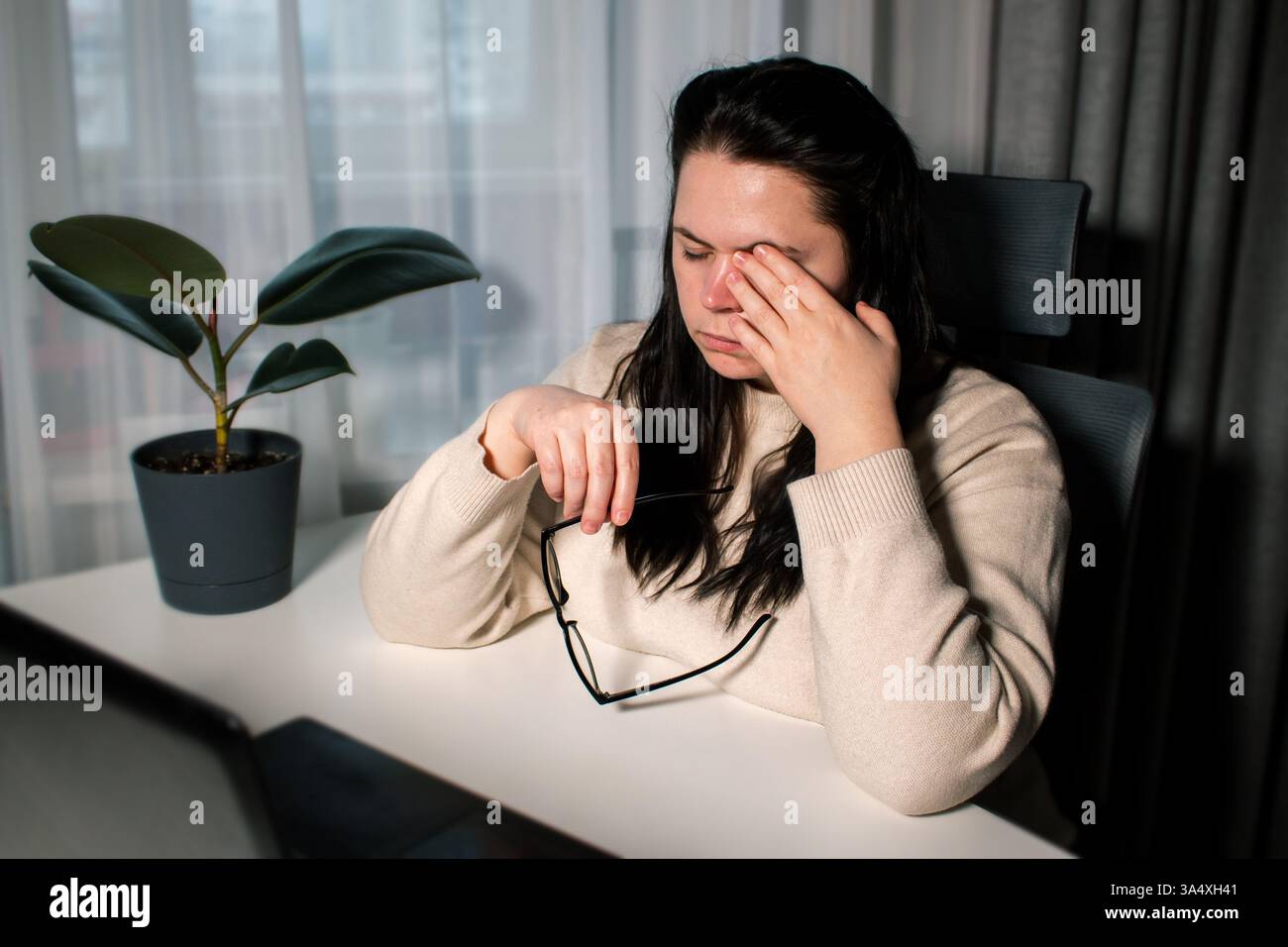 Tired business woman having fatigue and headache during work with ...