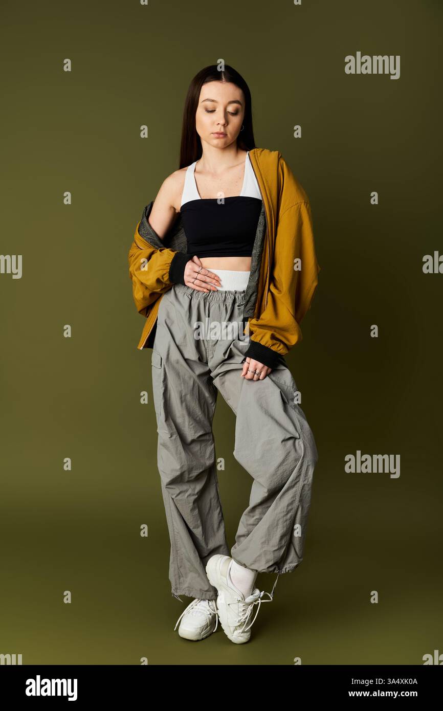 A confident woman poses in stylish attire, merging comfort with modern ...