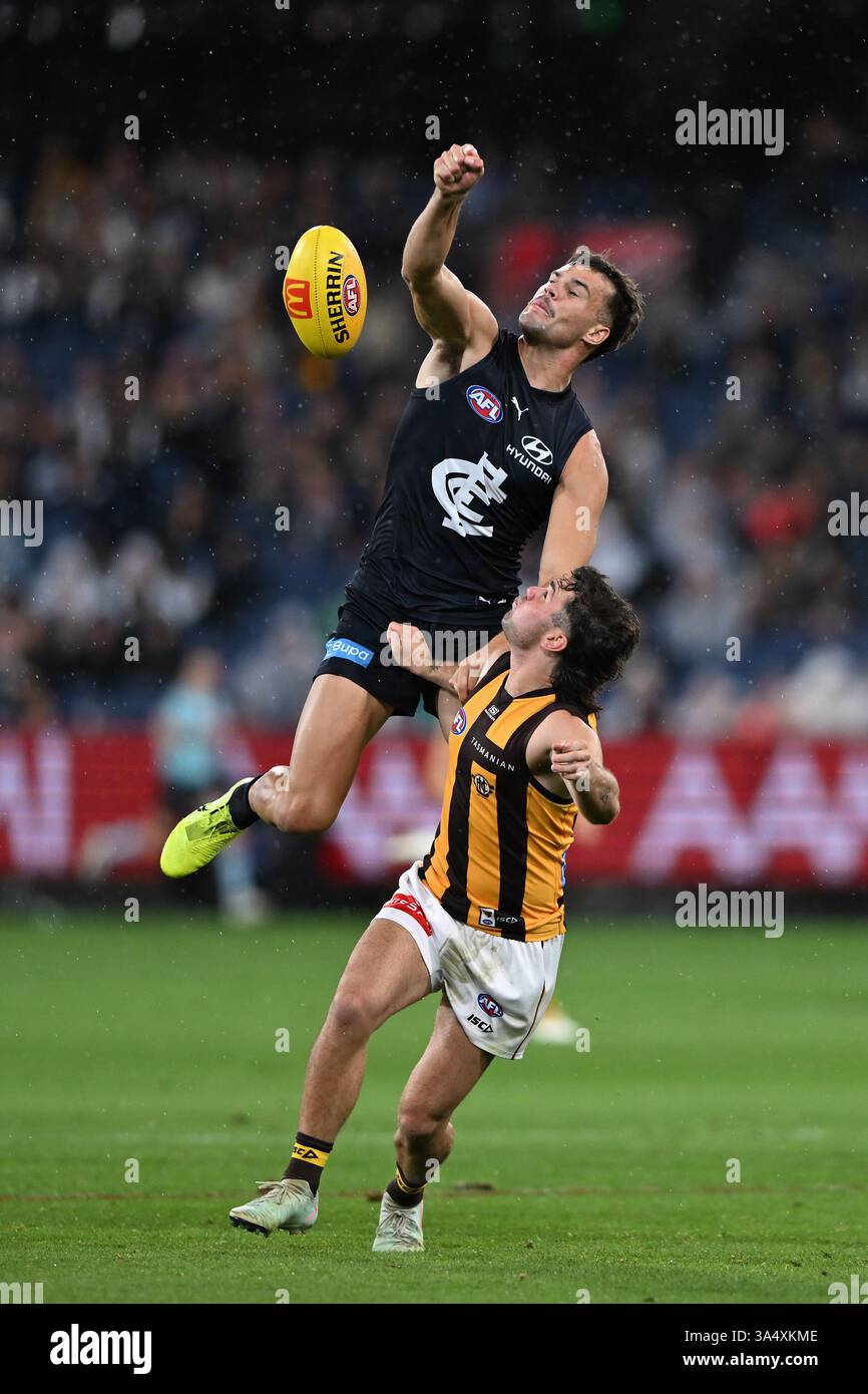 Lachlan Cowan of Carlton (left) in action during the AFL Round 2 match ...