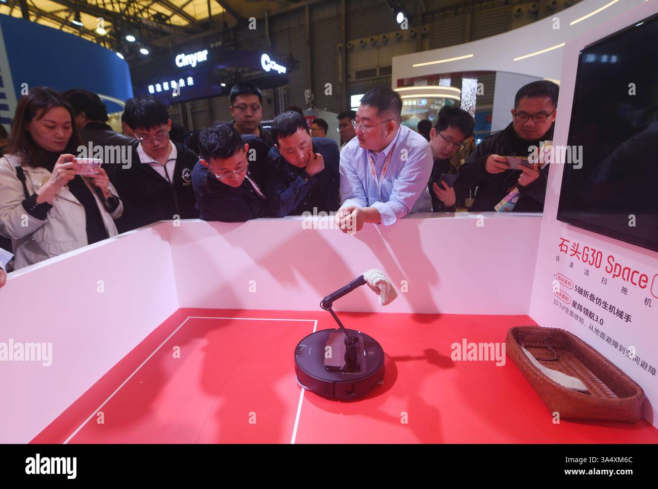 Spectators watch roborock Technology's home intelligent cleaning robot ...