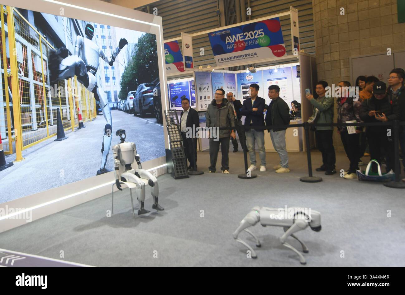 Visitors watch a video of a UNITREE G1 humanoid robot performing ...