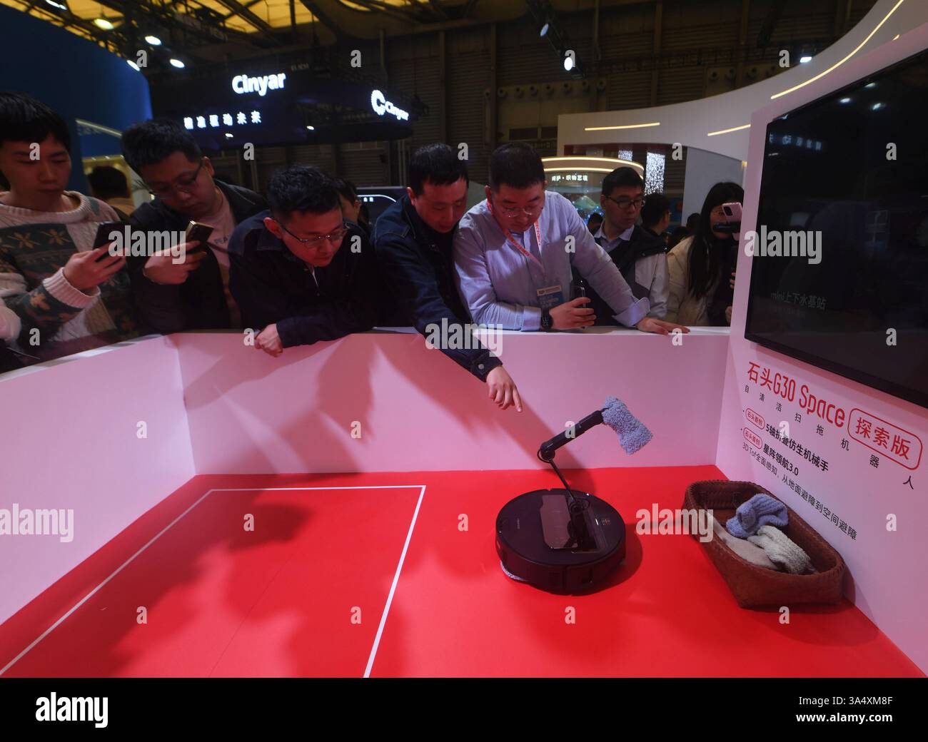 Spectators watch roborock Technology's home intelligent cleaning robot ...
