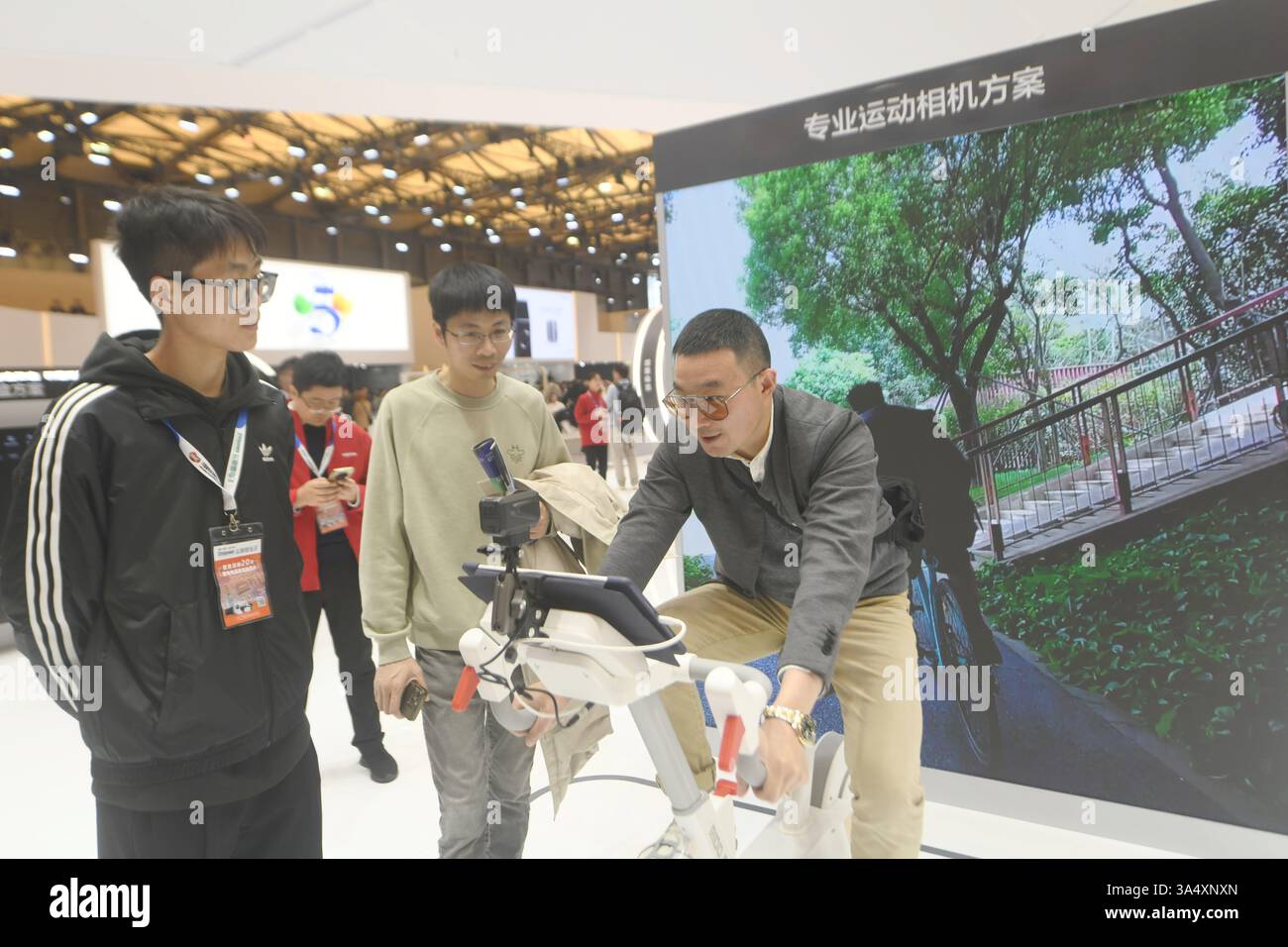 Visitors experience a virtual ride at the Huawei hisilicon booth at 2025AWE in Shanghai, China ...