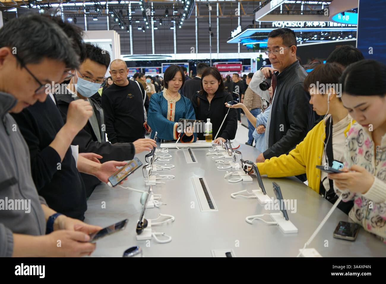 SHANGHAI, CHINA - MARCH 20, 2025 - Visitors visit the HUAWEI booth at ...