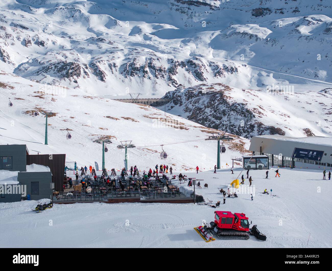 Aerial view of ski resort with snowcat, ski lifts, and mountains Stock ...