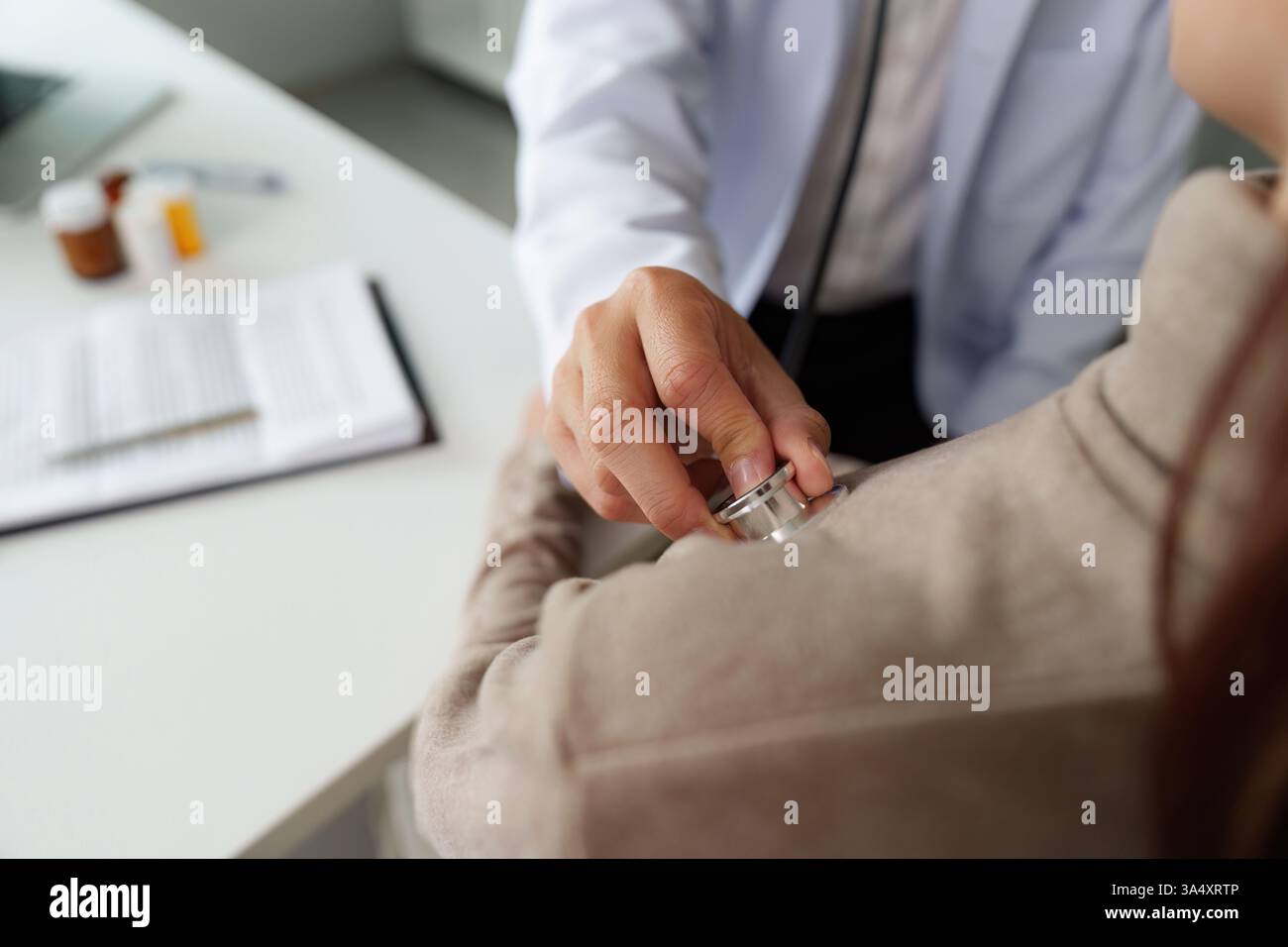 Physical Examination and Patient Interaction. A doctor uses a ...