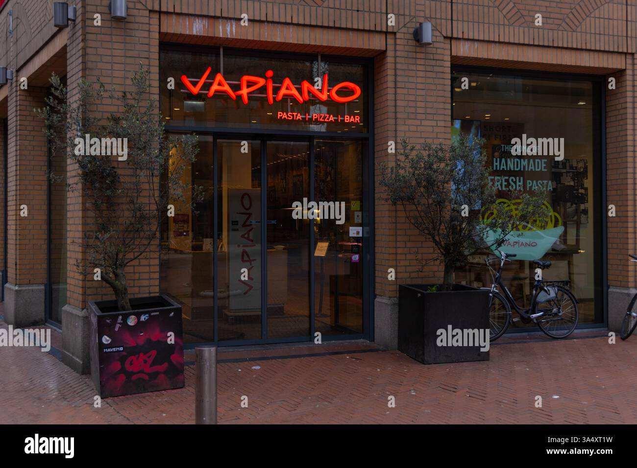 Vapiano logo sign at the restaurant. Vapiano is a chain of eateries ...