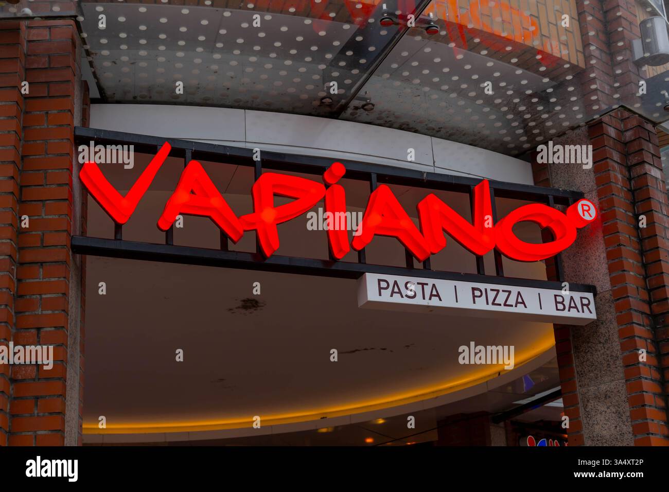 Vapiano logo sign at the restaurant. Vapiano is a chain of eateries ...