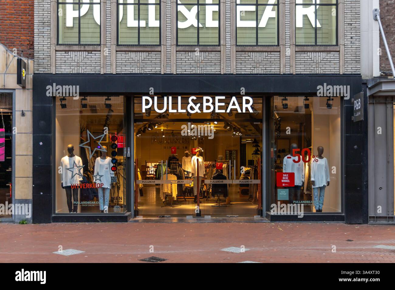 Pull & Bear sign logo and entrance store in a shopping street. Pull ...