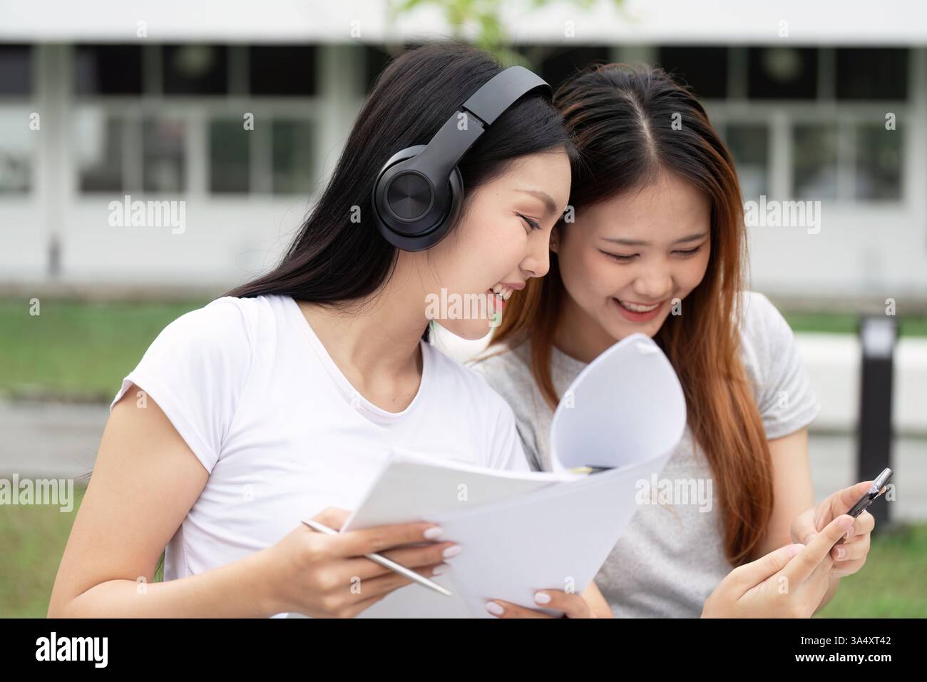 Study Buddies and Education. Two students engaged in collaborative learning, sharing insights ...