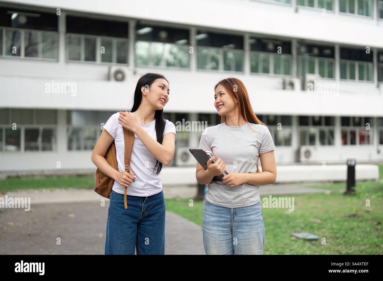 Learning and Academic Exchange. Two students share a moment of ...