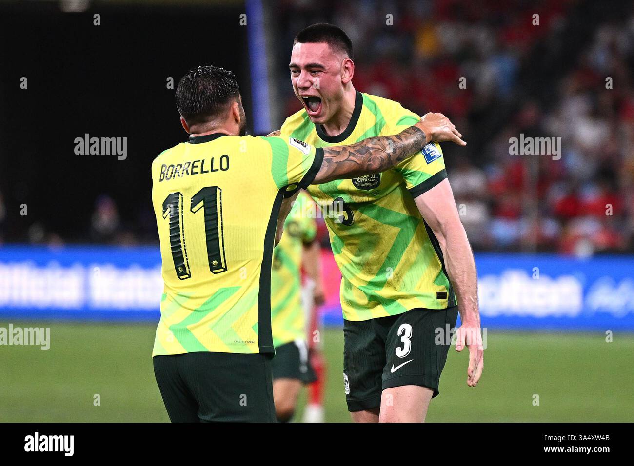 Lewis Miller of the Socceroos (right) celebrates with Brandon Borrello ...