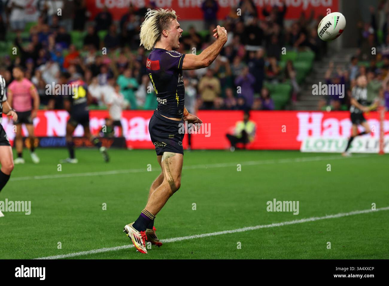 Ryan Papenhuyzen of the Storm celebrates scoring a try during the NRL ...