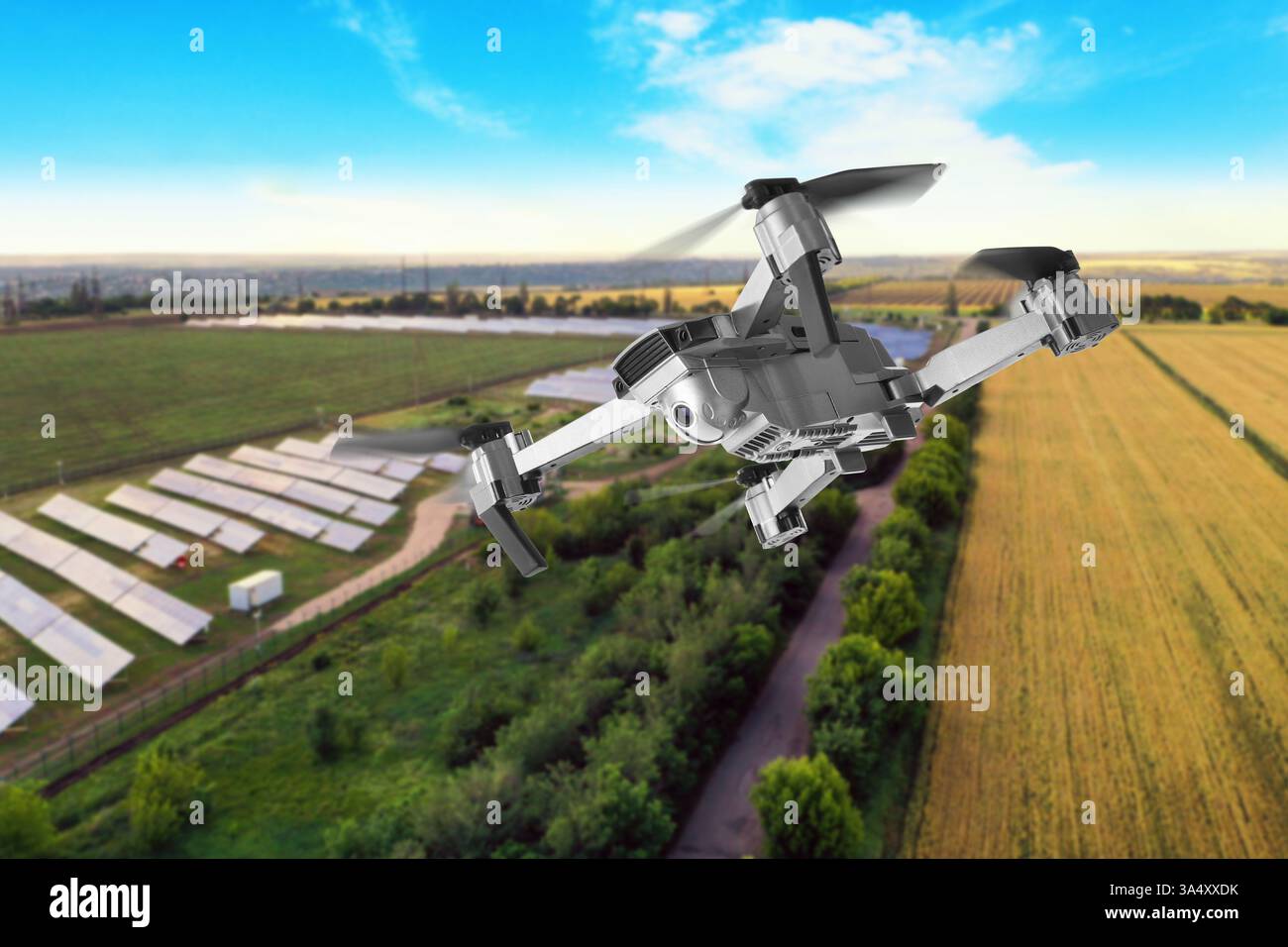 Drone with camera flying over fields. Unmanned aerial vehicle for ...