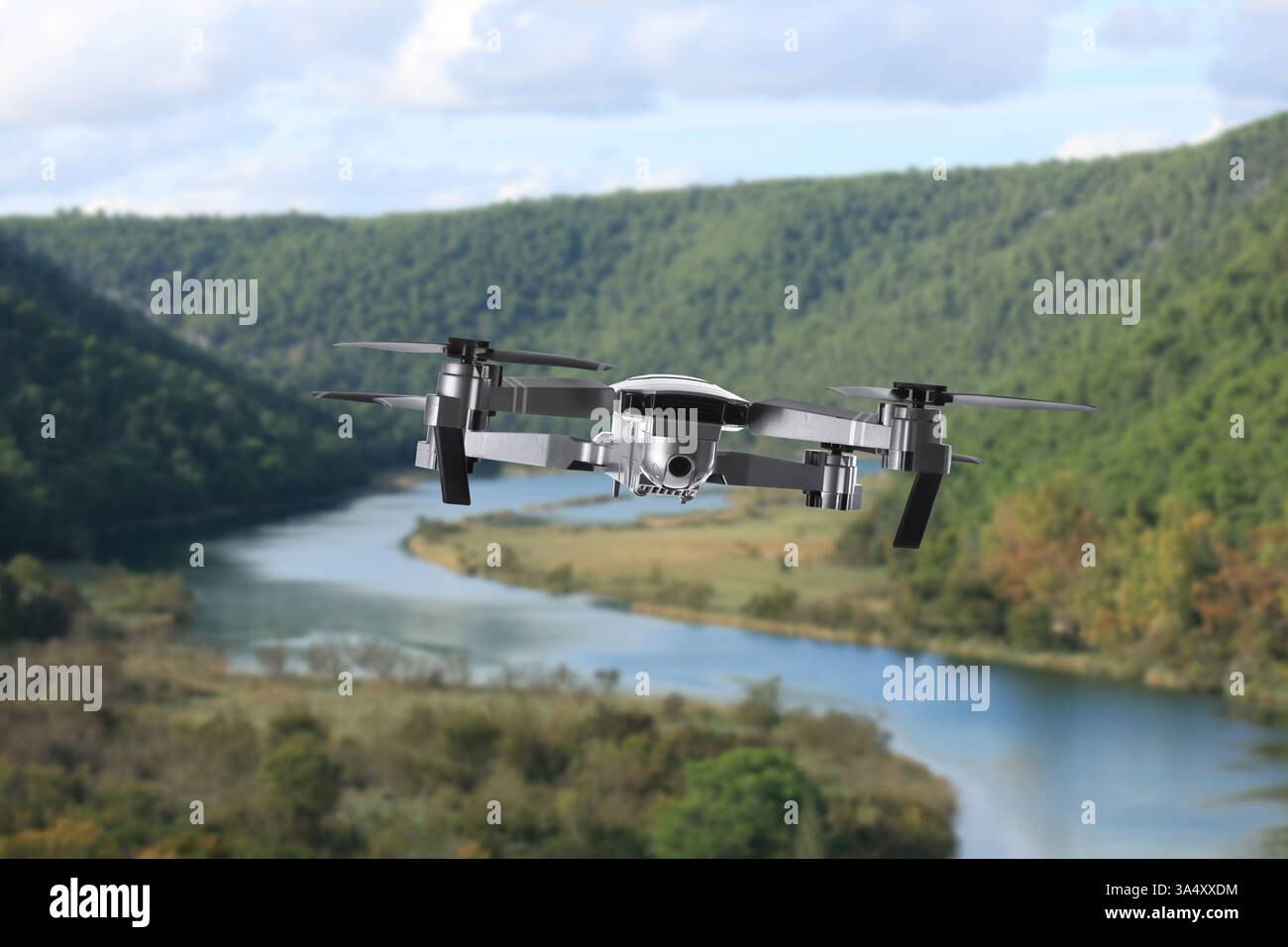 Drone with camera flying in mountains. Unmanned aerial vehicle for ...