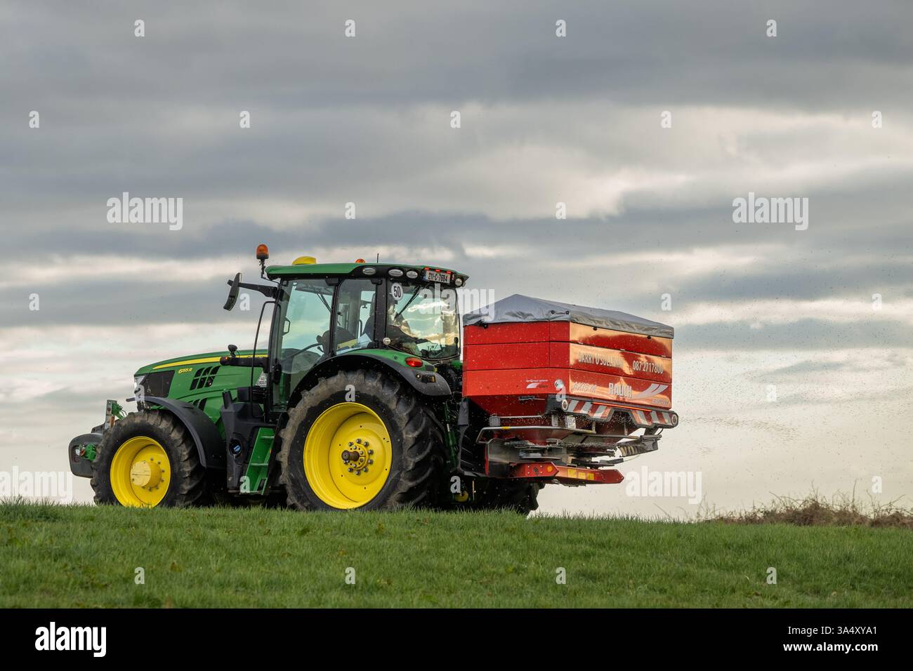 Agricultural contractor spreads fertiliser in Connonagh, West Cork ...