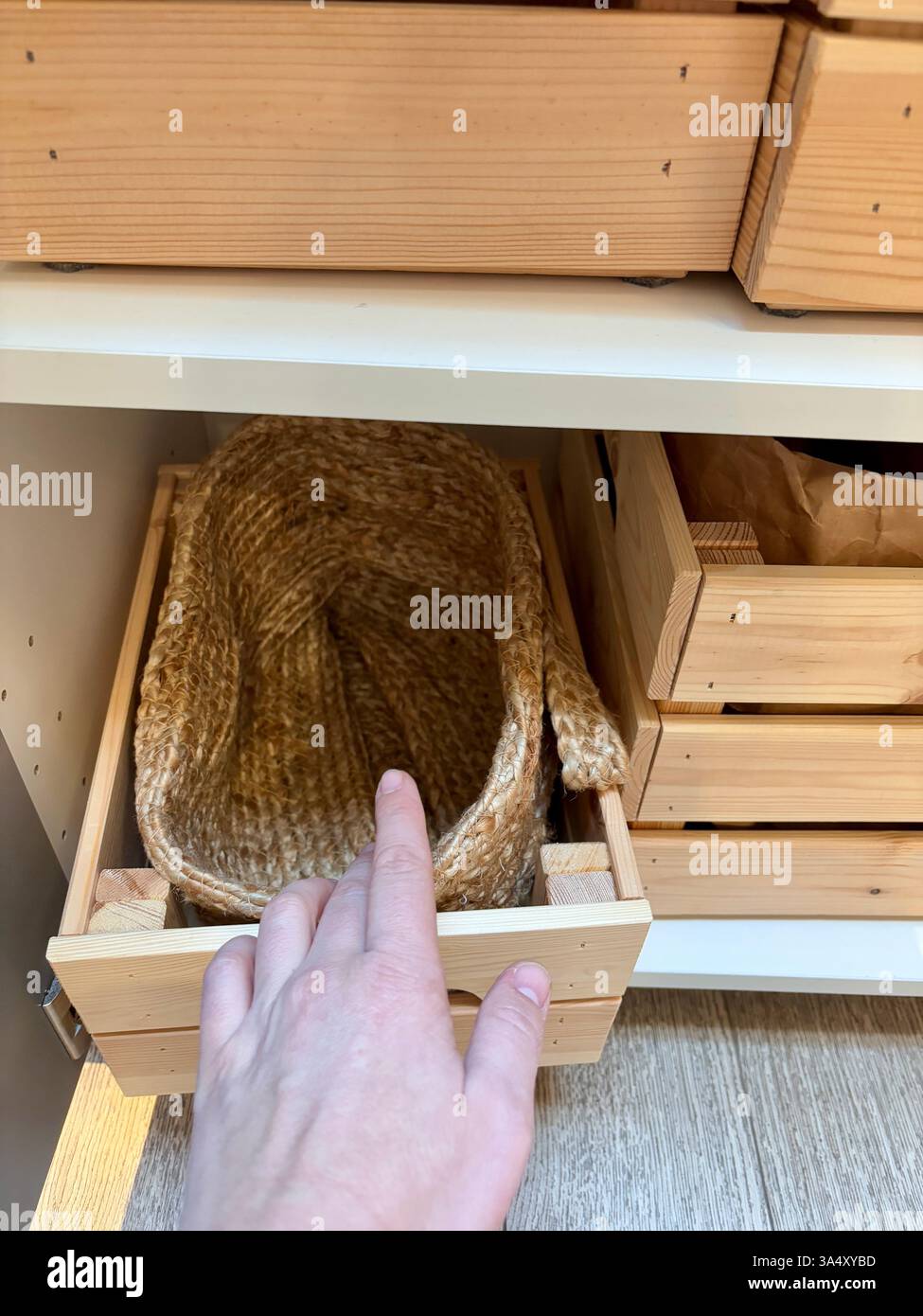 Organized wooden crates inside a kitchen cabinet for efficient storage ...