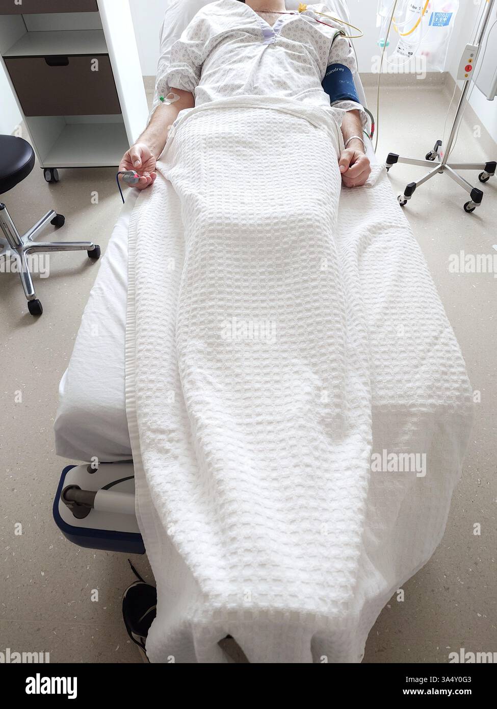 IV drip, cannula or branula, a pulse oximeter and a blood pressure ...