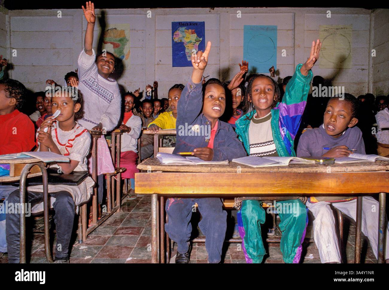 Ethiopia, Addis Abeba; children in primary school raise their hands ...