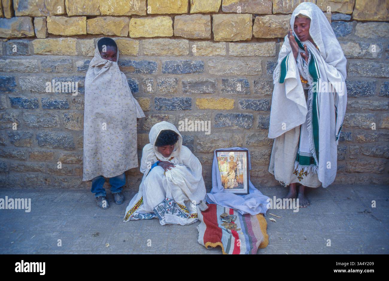 Ethiopia, Mekelle, in front of a church, a family is begging with an ...