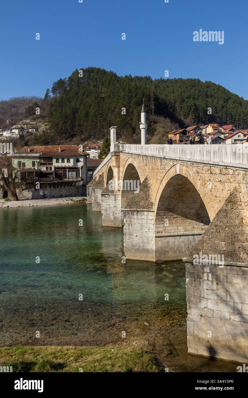The historic Stara Ćuprija bridge over the Neretva River in the old town of Konjic on a hot ...