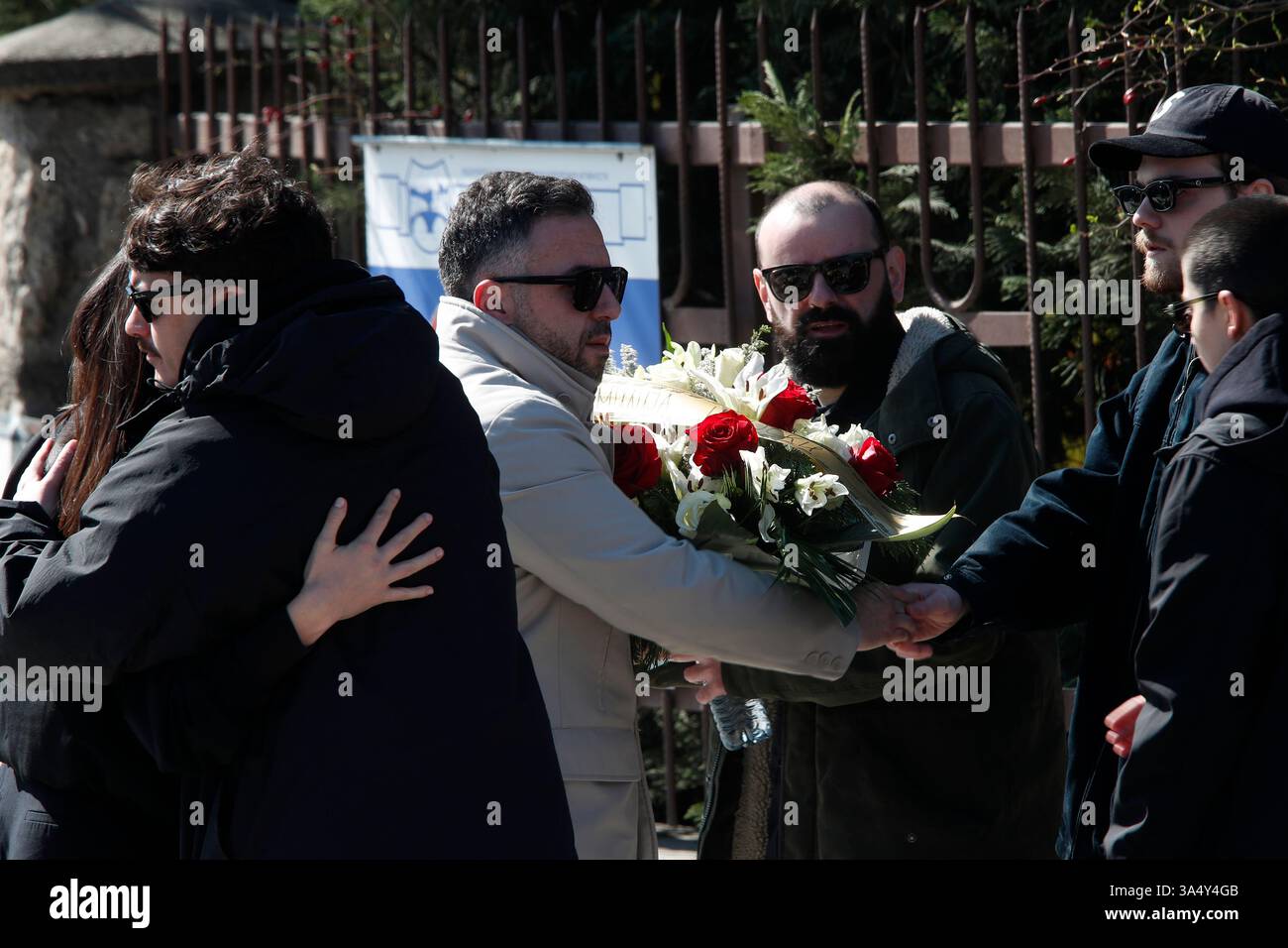 People greet each other as they attend the funeral of Andrej Gjorgieski ...