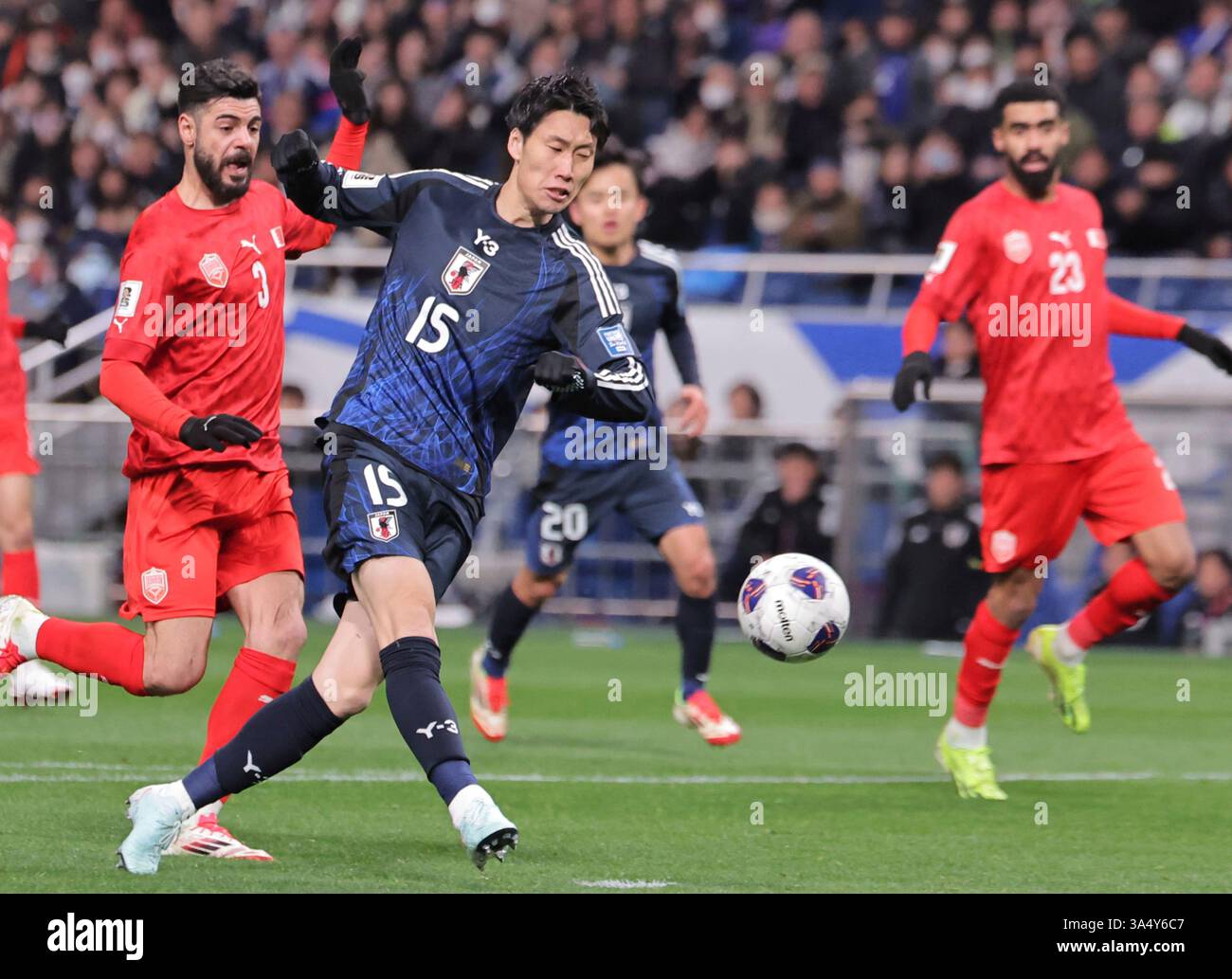 Japan's Daichi Kamada (C, 15) scores the team's first goal in the ...