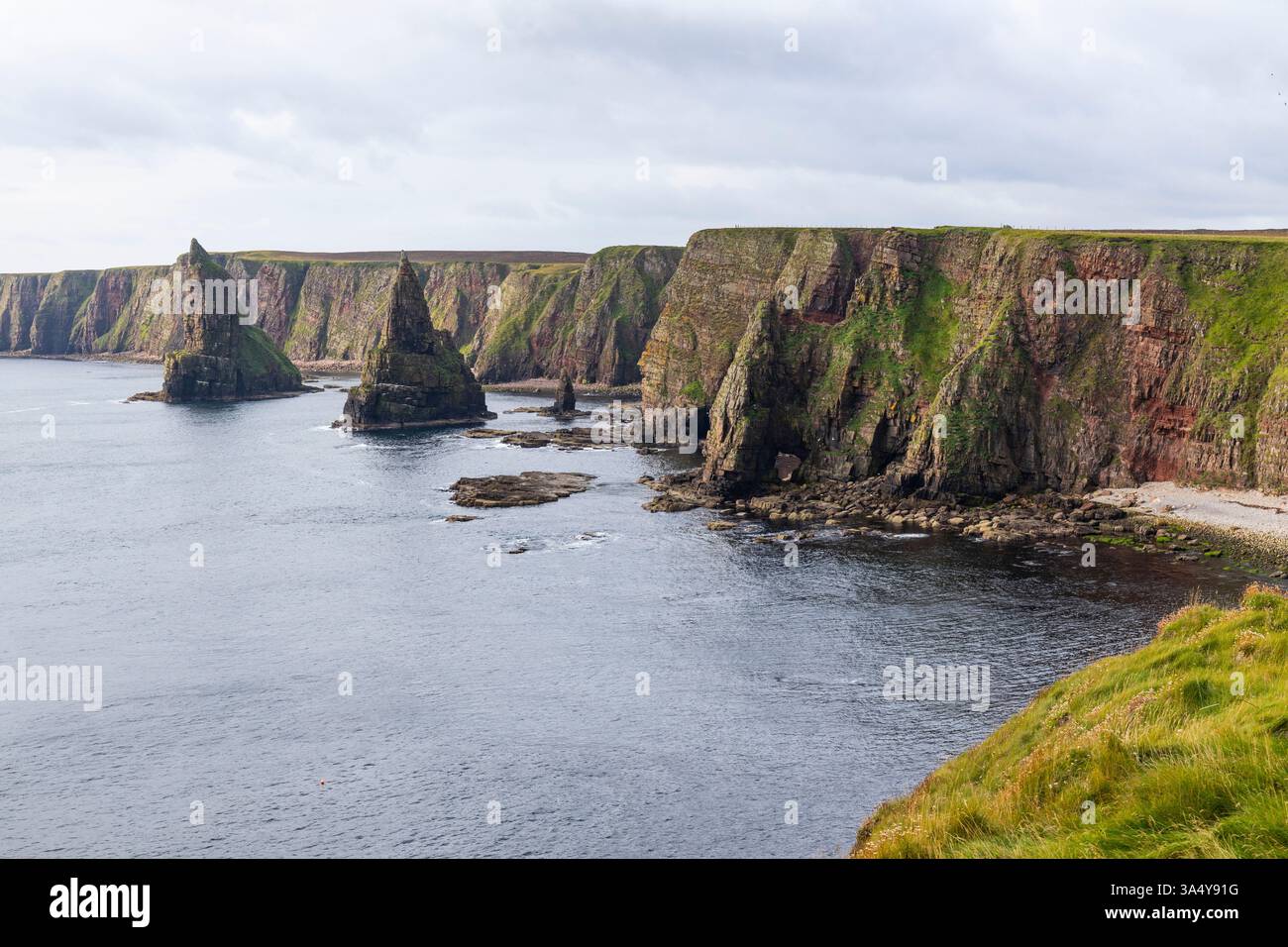 Duncansby Stacks, a breathtaking coastal wonder in Scotland, rise from the North Sea. Standing ...