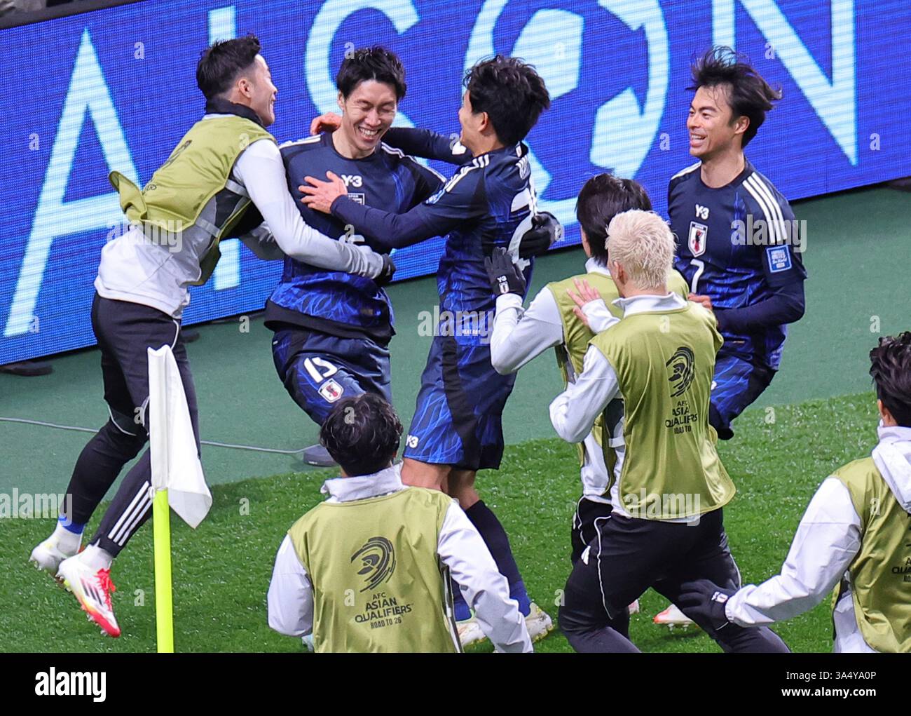 Japan's Daichi Kamada (second from left, 15) reacts after scoring the ...