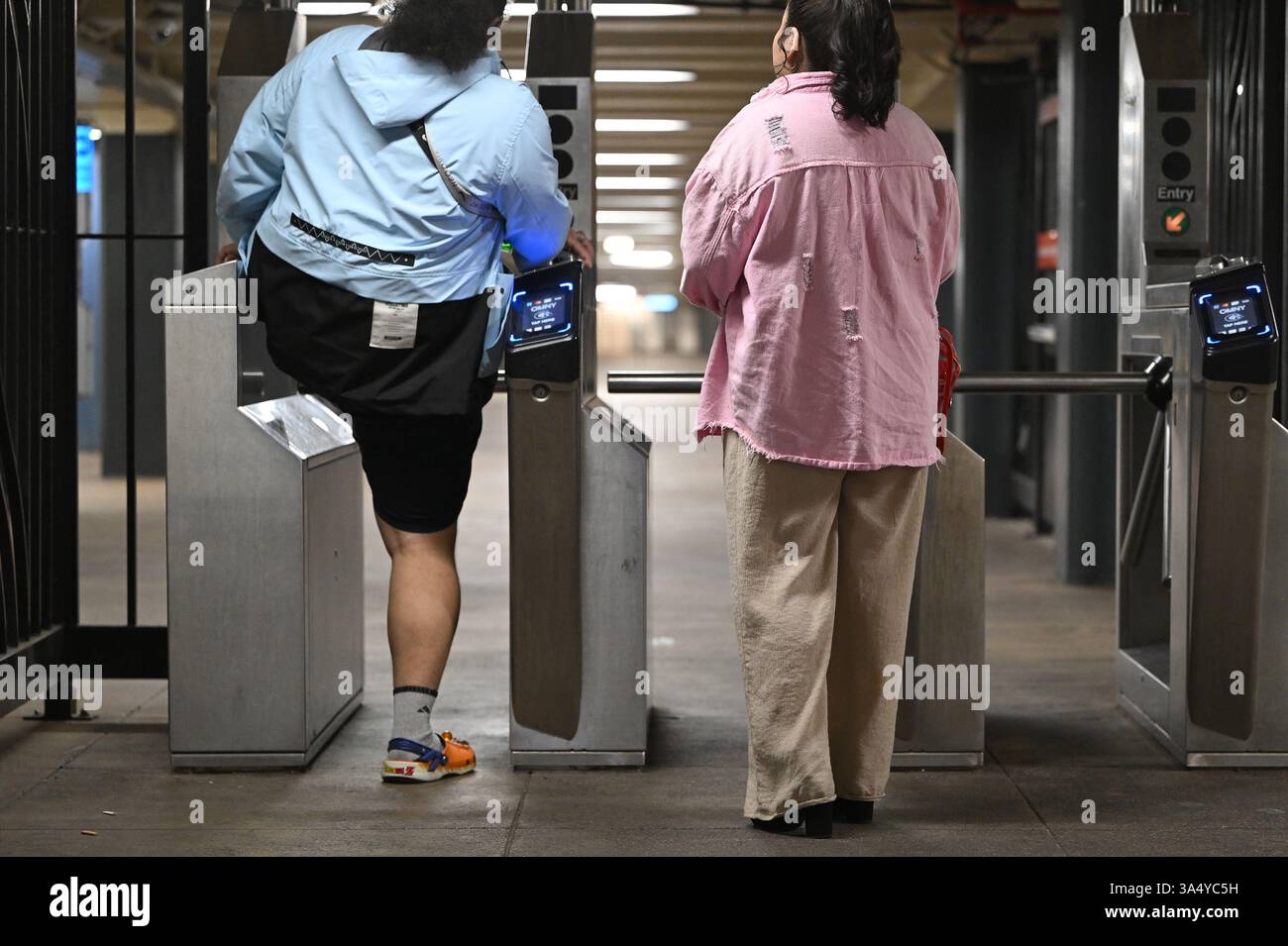 A man avoids paying a subway fare by 'jumping' turnstile, in the New ...