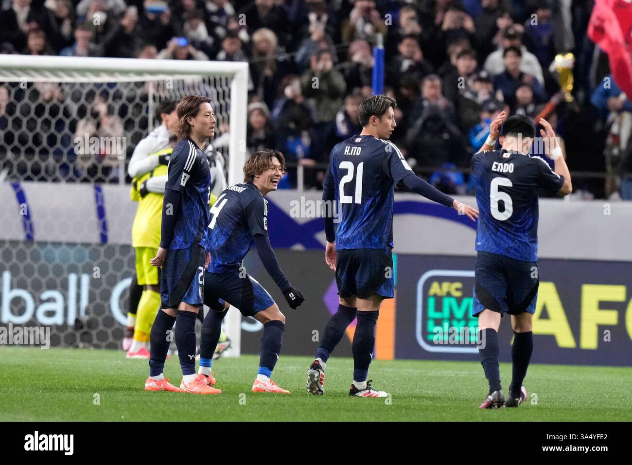 Japan players celebrate after defeating Bahrain in the World Cup ...