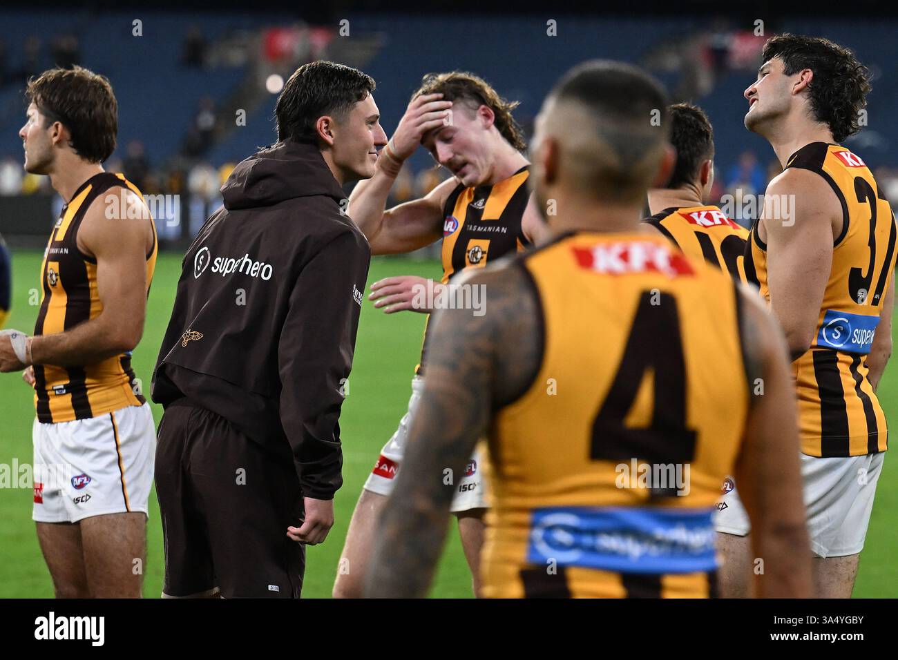 Connor Macdonald of the Hawks (2nd left) during the AFL Round 2 match ...