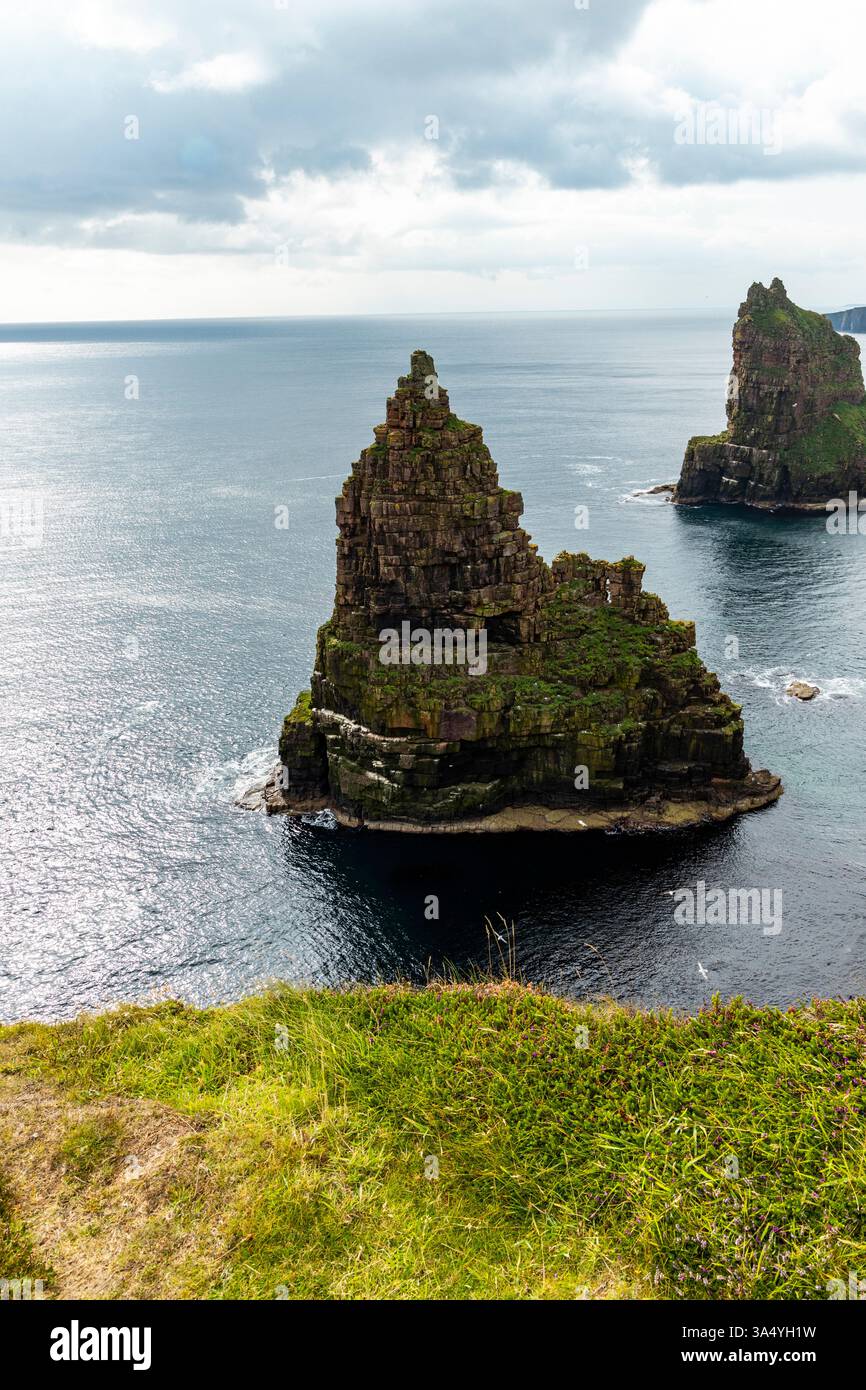 Duncansby Stacks, a breathtaking coastal wonder in Scotland, rise from the North Sea. Standing ...