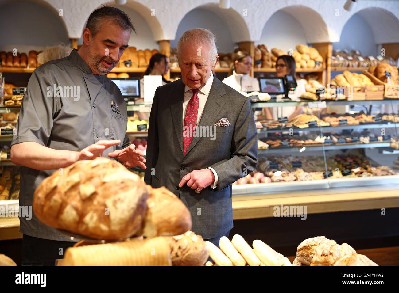 King Charles III is given a tour of Hunters Bakery in Limavady, on day ...