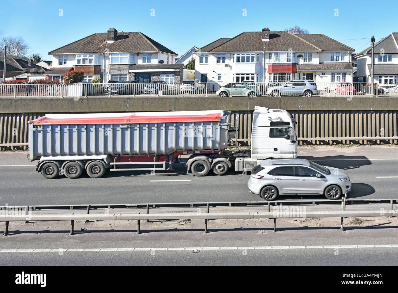 HGV lorry truck articulated trailer & car driving on A12 trunk road ...
