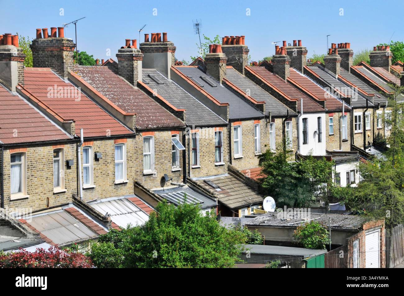 Back gardens view long row terraced houses repetitive line of brick ...