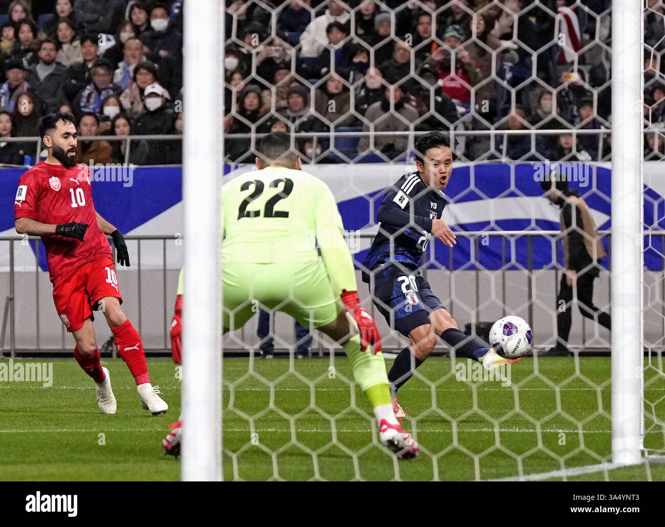 Japan's Takefusa Kubo (blue) scores the team's second goal in the ...
