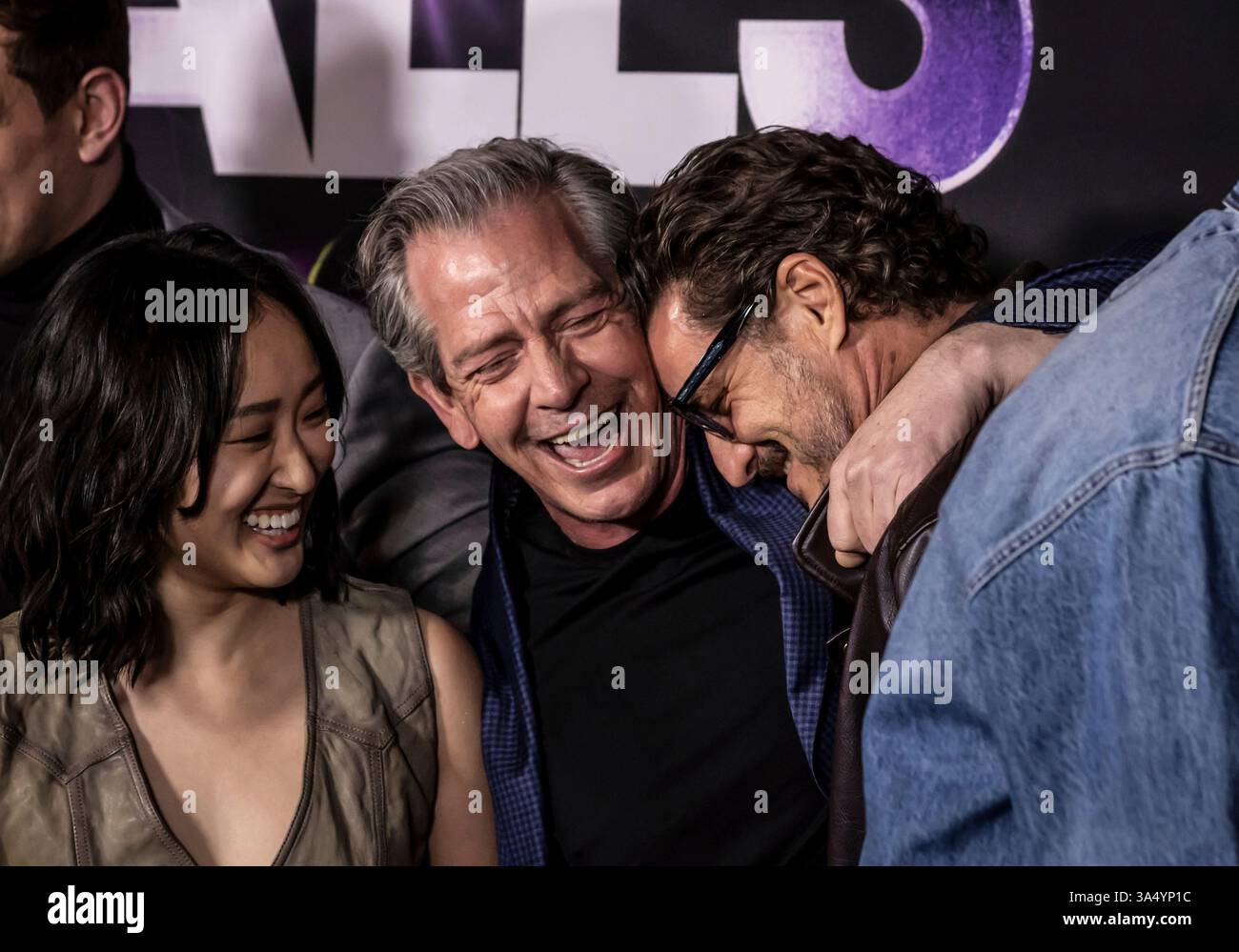 Actor Pedro Pascal hugs Ben Mendelsohn as Ji-Young Yoo smiles on the ...