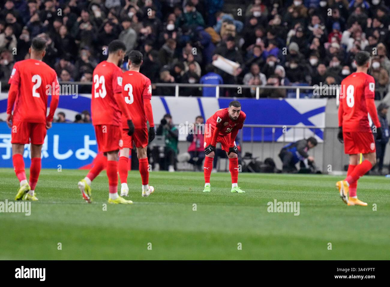 Bahrain players react after their loss against Japan in the World Cup ...