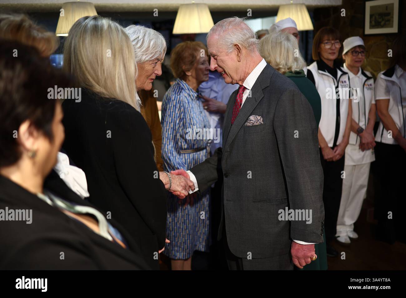 King Charles III meets members of staff during a visit Hunters Bakeryin ...