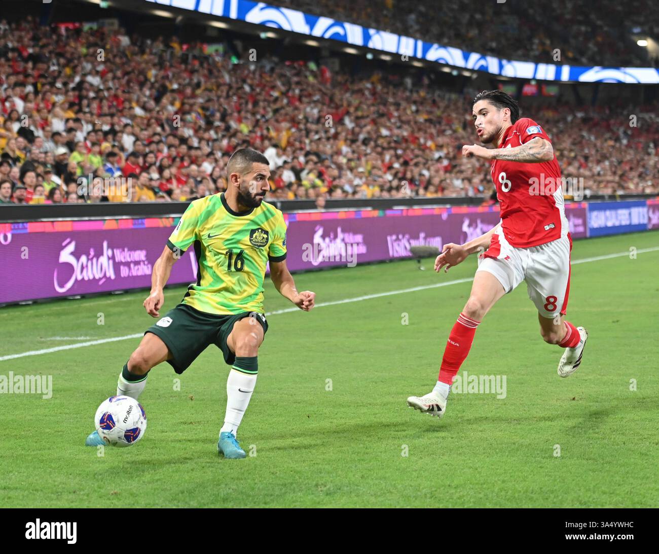 Sydney, Australia. 20 Mar 2025, Australia's Aziz Behich and Indoensia's ...