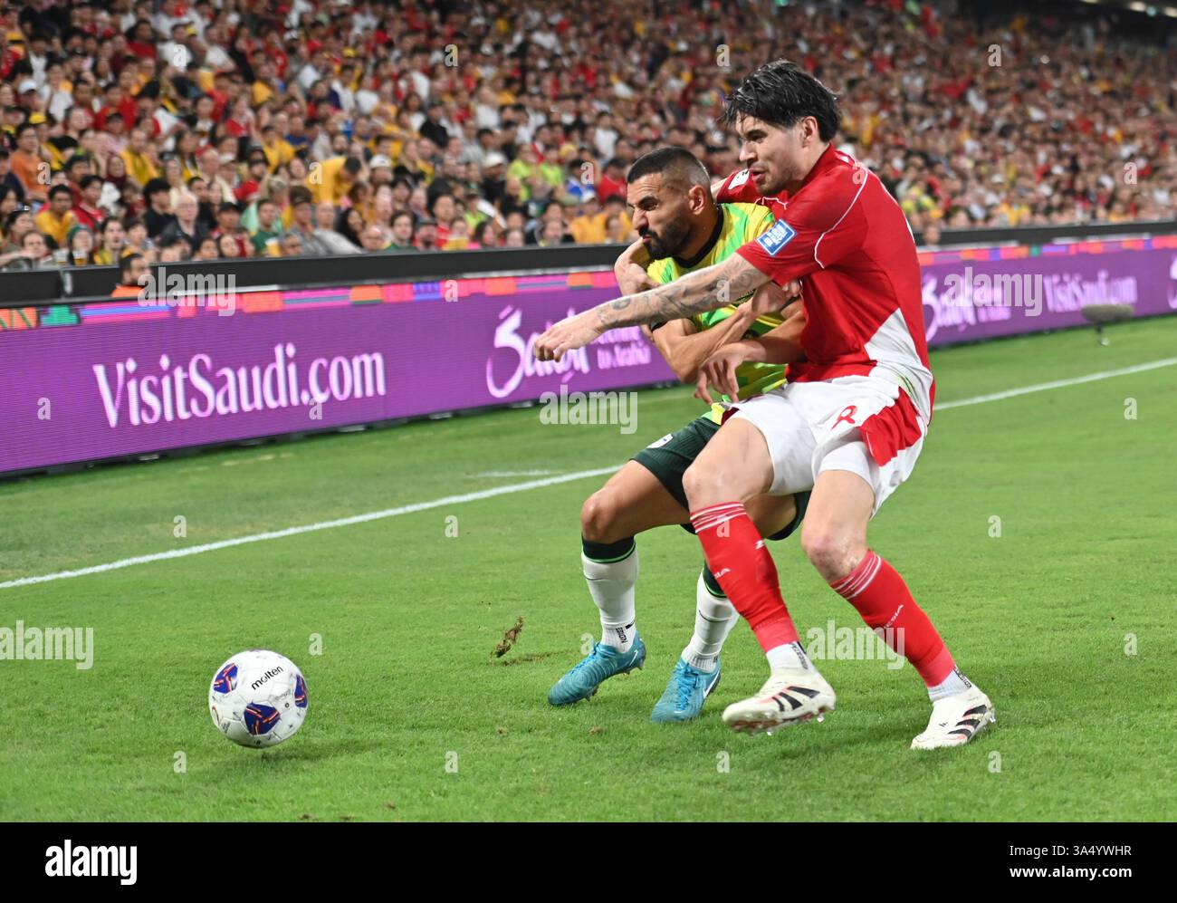 Sydney, Australia. 20 Mar 2025, Australia's Aziz Behich and Indoensia's ...